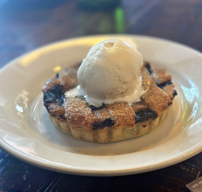 This blueberry pie with melting ice cream isn't dessert—it's what happiness would look like if it took physical form.