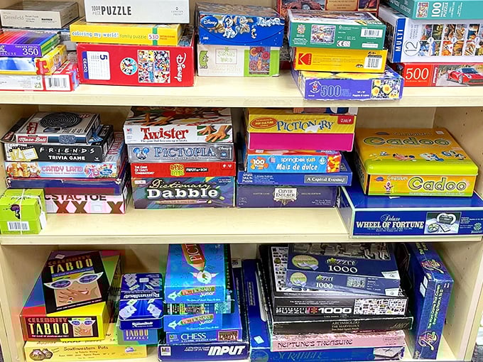 Game night nostalgia stacked three shelves deep—where family feuds and friendly competitions await resurrection at a fraction of retail prices.