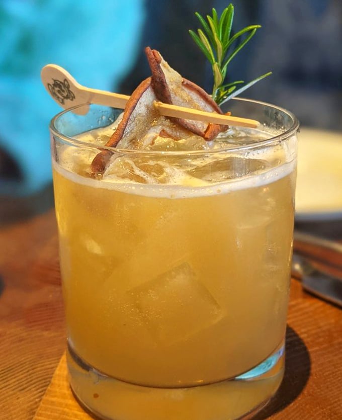This isn't just a cocktail—it's liquid architecture with rosemary and apple garnish that transforms bourbon into something worth savoring slowly.