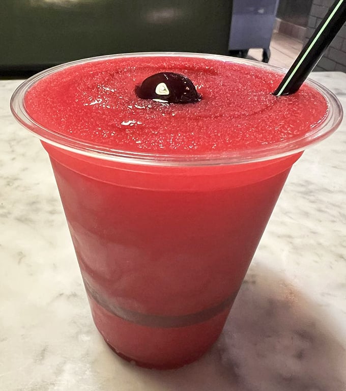 The vibrant Brassarita—a ruby-red refresher that's like summer in a cup. This isn't your poolside slushie; it's what grown-up beverages aspire to be.