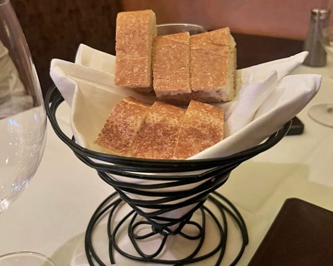 The bread basket—that humble opening act that separates good steakhouses from great ones. Simple, crusty, and ready for butter duty.