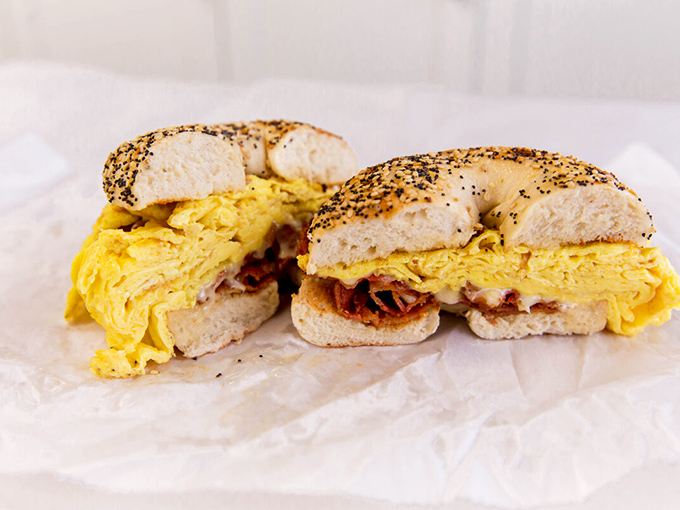 Breakfast on a bagel—the morning equivalent of a warm hug. Golden eggs and crispy bacon nestled together like old friends.