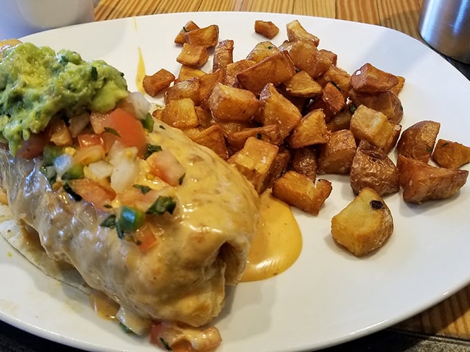 The breakfast burrito, wrapped like a present and stuffed with smoky goodness, proves that the best gifts don't always come in small packages.