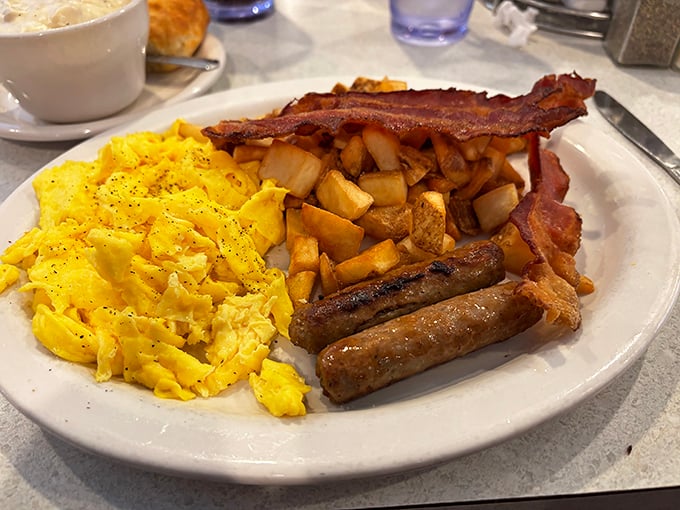 The breakfast trinity – fluffy scrambled eggs, crispy bacon, and sausage links that snap with each bite. Hallelujah!
