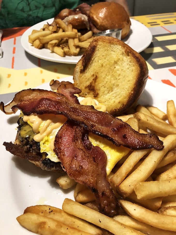 This isn't just breakfast on a bun—it's morning architecture. Layers of egg, bacon, and cheese create the foundation of a perfect day.