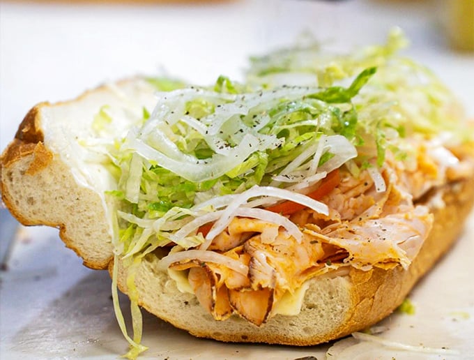 A buffalo chicken hoagie topped with shredded lettuce proves that Ricci's isn't just about tradition—they know how to satisfy modern cravings too.