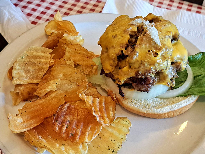Sometimes the perfect burger needs nothing more than crispy chips and a cozy schoolhouse setting.