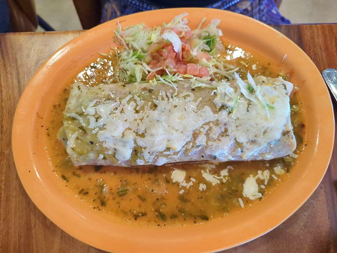 This burrito isn't just wrapped—it's lovingly enrobed in a green chile blanket. The perfect marriage of comfort food and culinary craftsmanship.
