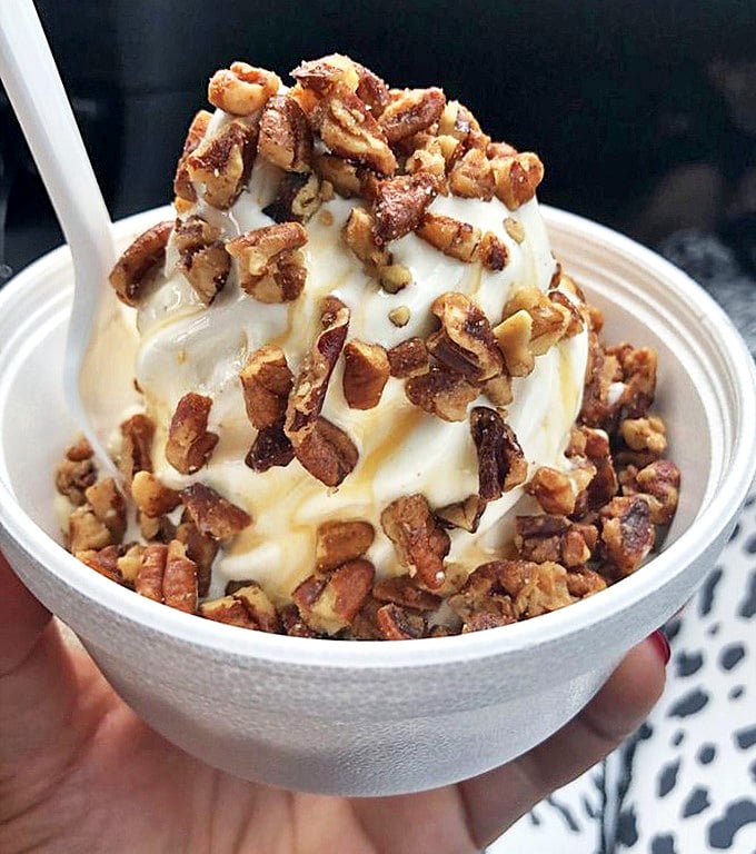 A butter pecan sundae that doesn't need Instagram filters – just honest-to-goodness vanilla soft serve crowned with crunchy, caramelized nuts.