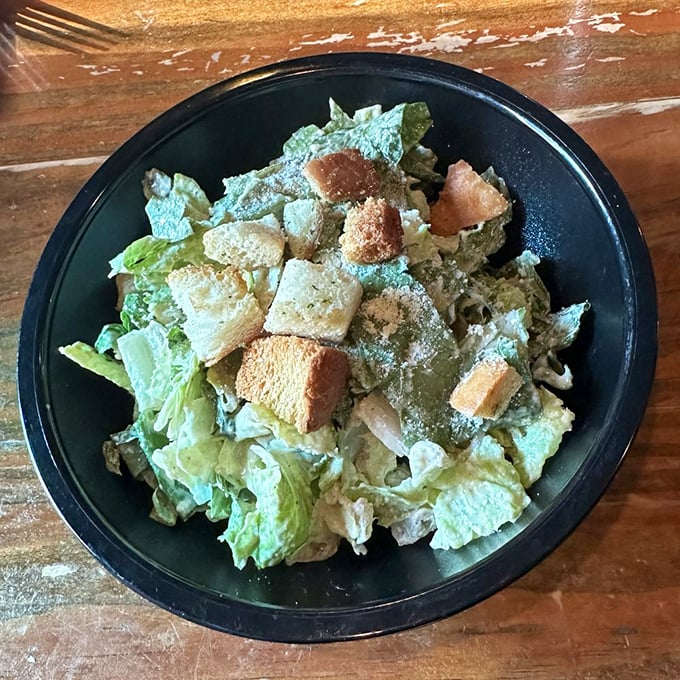 Even the Caesar salad gets special attention – crisp romaine, golden croutons, and just enough dressing to complement without drowning.