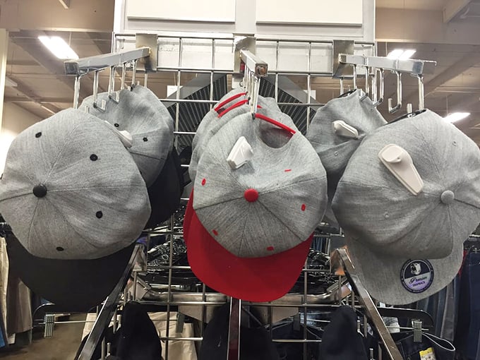 Baseball caps in various states of coolness stand at attention. Someone's abandoned team loyalty could become your new weekend identity.