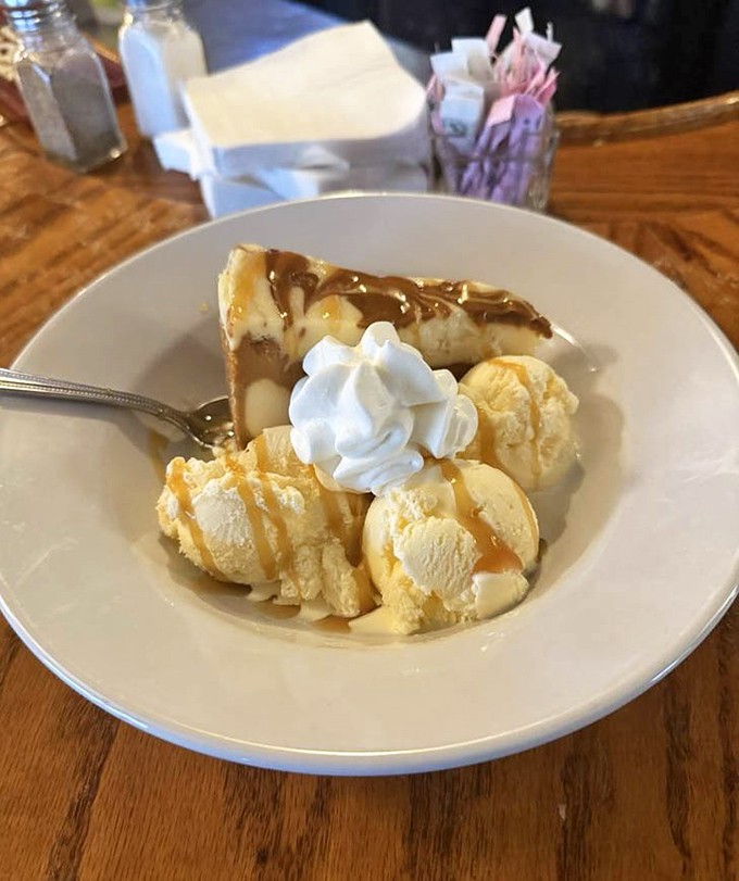 Caramel cheesecake with vanilla ice cream—proof that the best relationships are sweet, rich, and slightly complicated.