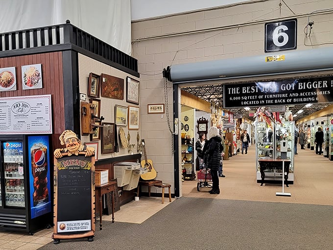 Vintage clothing shares space with collectibles in this well-organized booth. Someone's childhood memories are about to become someone else's retro statement piece.