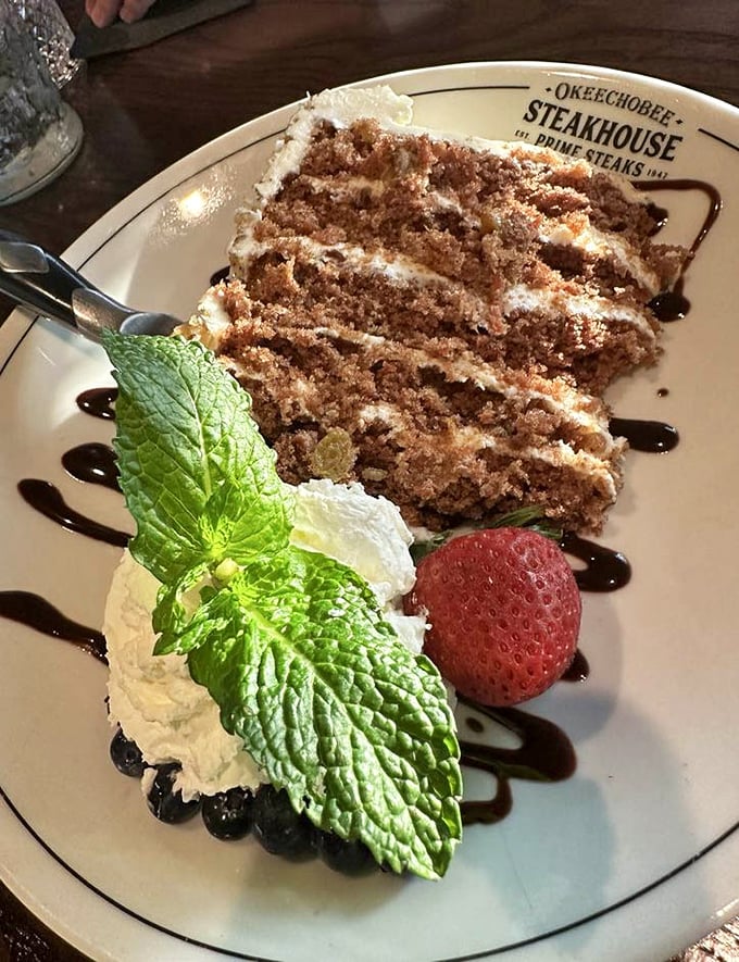 A slice of carrot cake that doesn't just end the meal but crowns it, with layers that tell a story of sweetness, spice, and everything nice.