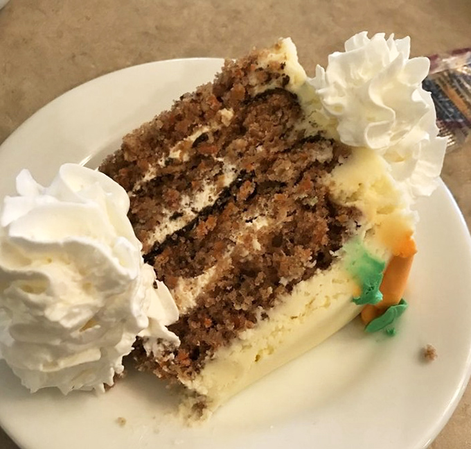Carrot cake that makes you question why anyone bothers counting carrots as a vegetable – this is dessert engineering at its finest.