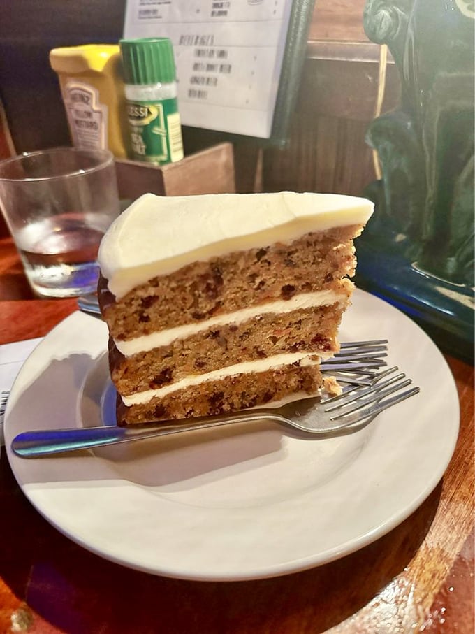 The carrot cranberry cake doesn't just have layers – it has chapters, with a cream cheese frosting epilogue that deserves its own book deal.