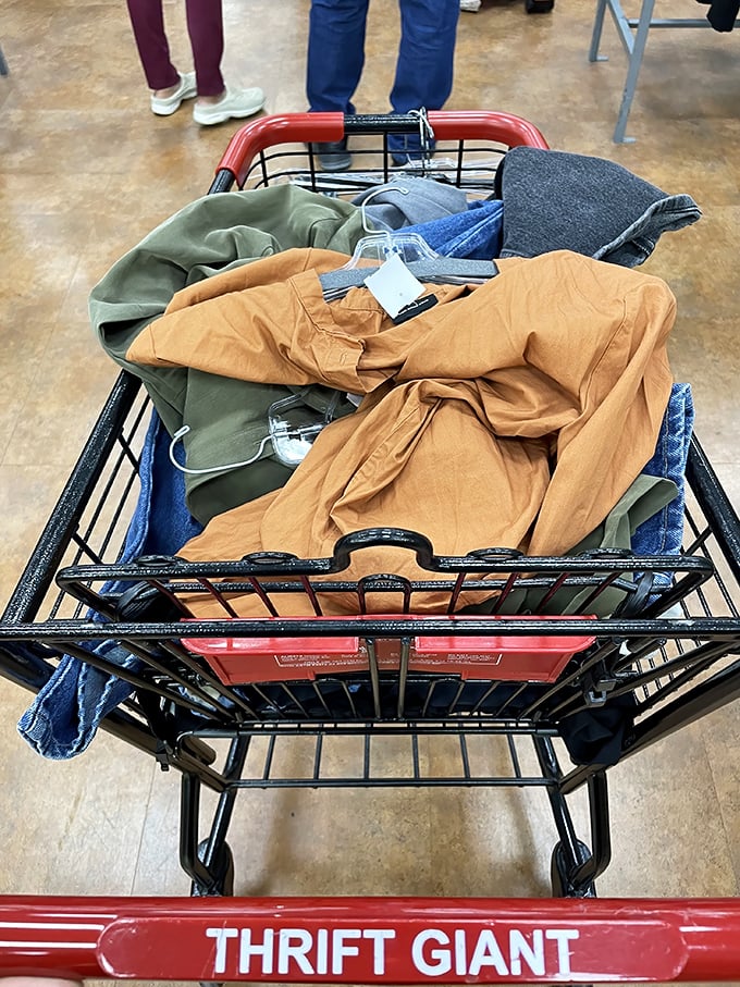 A cart brimming with potential – earth-toned clothing treasures awaiting their second act. Every item tells a story you get to continue. 