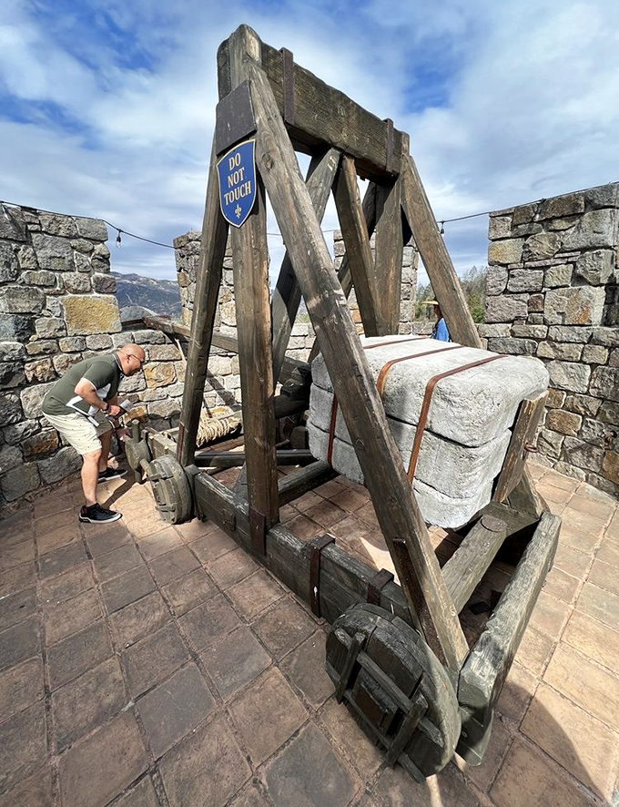Do Not Touch indeed! This medieval trebuchet reminds us that castles weren't just pretty buildings—they were defensive powerhouses with attitude.