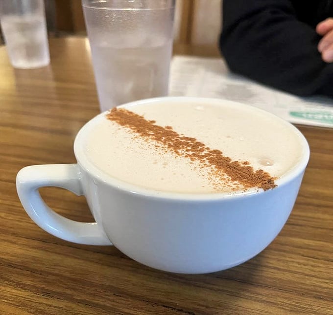 A chai latte with the perfect foam-to-liquid ratio—the kind that makes you linger at your table long after the food is gone.