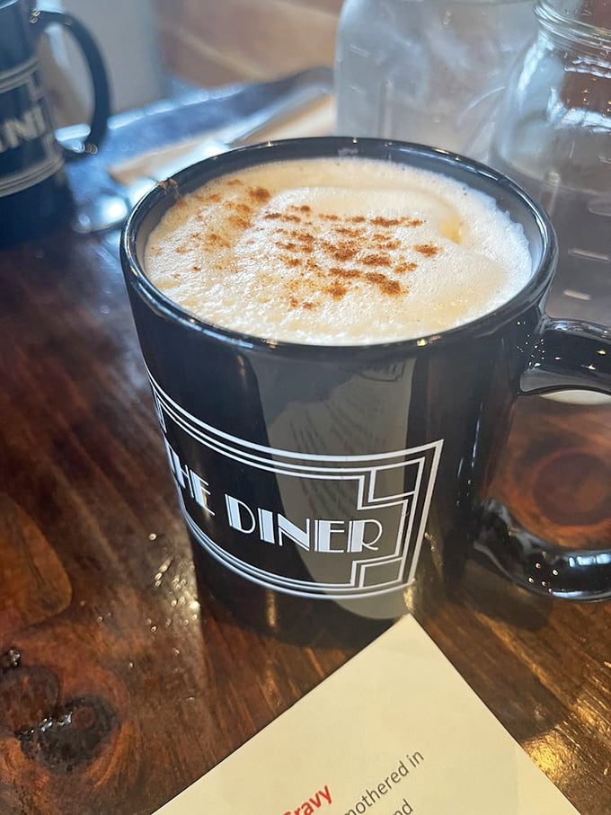 Their signature chai arrives with a cinnamon dusting that forms a delicate topography on foam. The mug itself practically whispers, "Take your time with me."