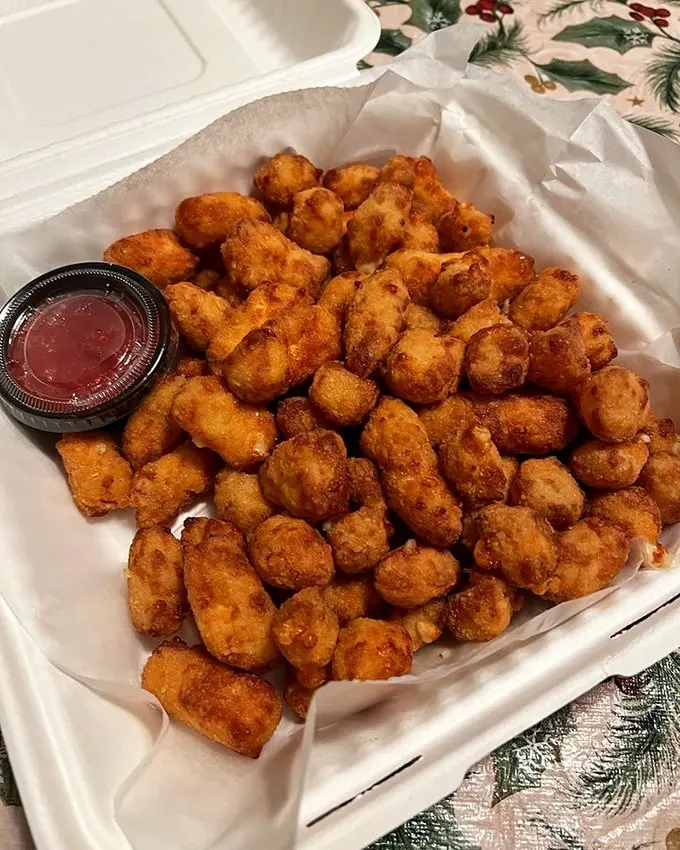 These cheese curds don't squeak – they sing. Wisconsin's finest dairy achievement gets the golden-fried treatment it deserves.