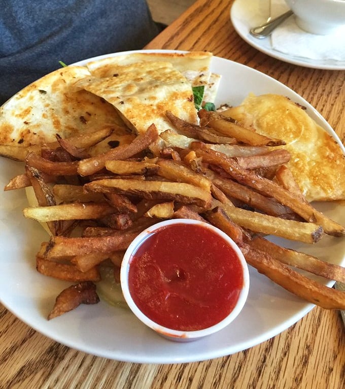 Quesadillas with purpose—crispy exterior, gooey interior, and those hand-cut fries that make you question why anyone would ever choose chips instead.
