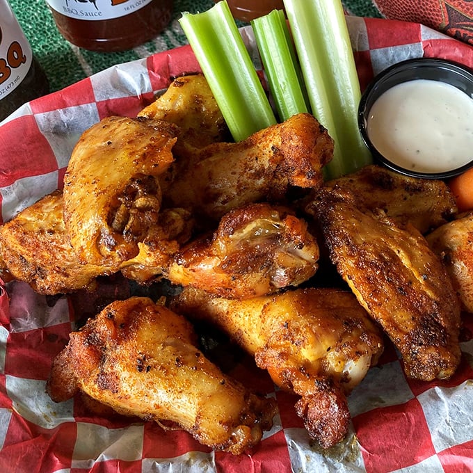 Wings that don't need a sporting event as an excuse—crispy, seasoned, and served with cooling celery stalks that provide the perfect counterpoint.