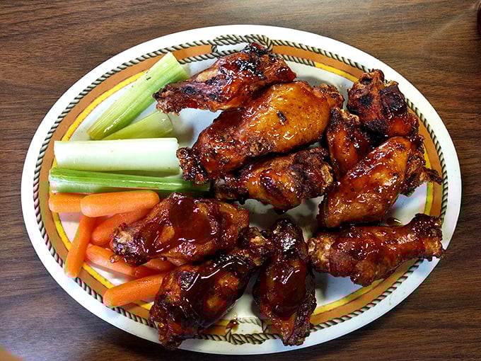Wings that look like they've been painted with BBQ love – crispy, sticky, and destined to leave evidence on your shirt as a souvenir.