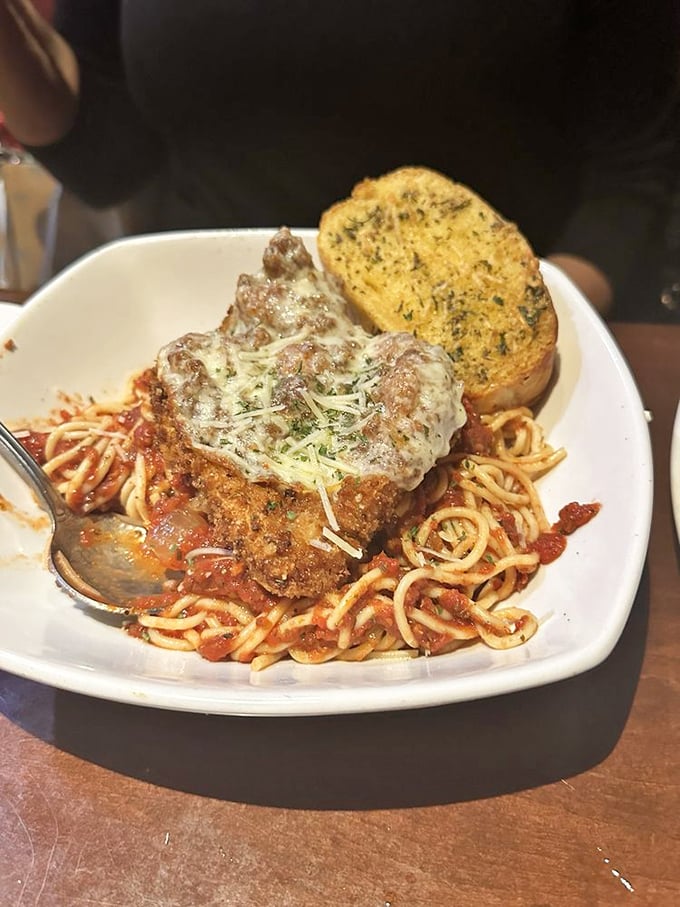 Italian meets Midwest in this chicken parmesan that's practically strutting atop its pasta runway. That garlic bread deserves its own fan club.