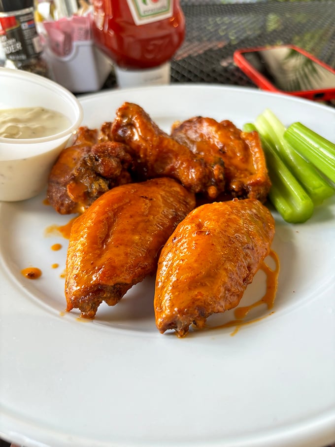 Buffalo wings that strike that perfect balance between spicy kick and savory satisfaction – napkins required, regrets forbidden.