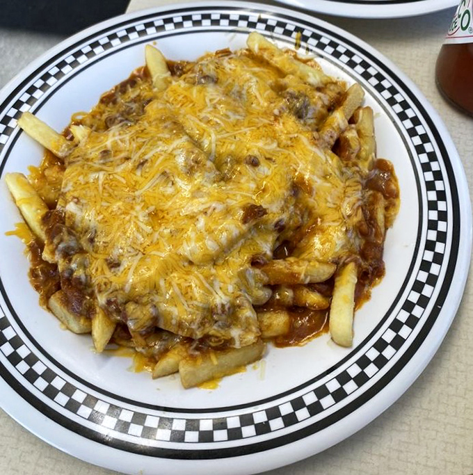 Chili cheese fries that don't apologize for their existence—a glorious mess that requires both a fork and absolutely zero shame.