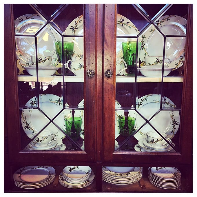 China cabinets displaying the kind of formal dining sets that make paper plates hang their heads in shame. Those green glasses have toasted more 1960s accomplishments than NASA.