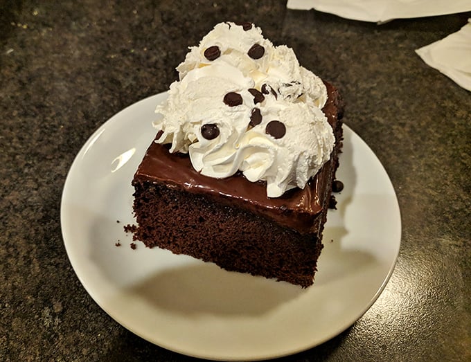 Chocolate cake that doesn't need fancy French names or edible gold leaf—just honest-to-goodness layers of happiness topped with whipped cream.