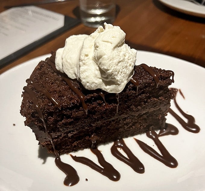 Chocolate cake that doesn't just satisfy your sweet tooth—it throws a party for it, complete with a whipped cream hat and chocolate sauce confetti. 