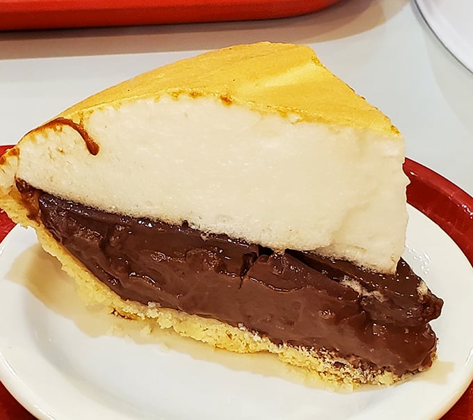 The chocolate cream pie features layers of mathematical perfection—equal parts silky chocolate pudding and cloud-like meringue that would make a geometry teacher proud.