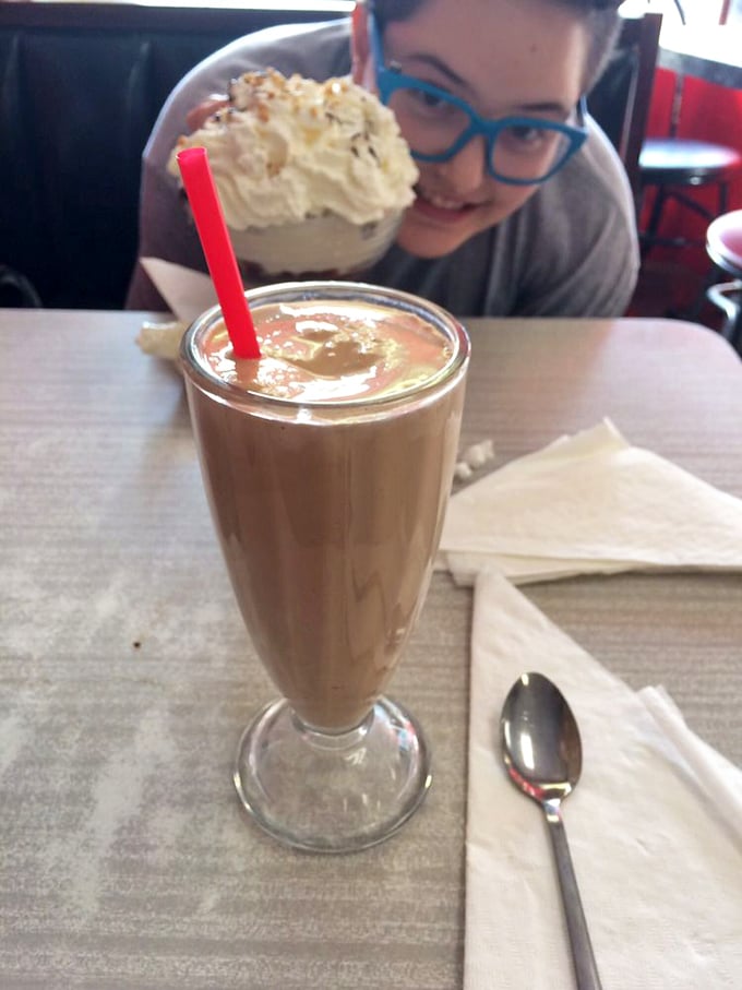 This chocolate malt isn't just a drink, it's a time machine in a glass—thick enough to require serious straw commitment and patience worthy of the reward.