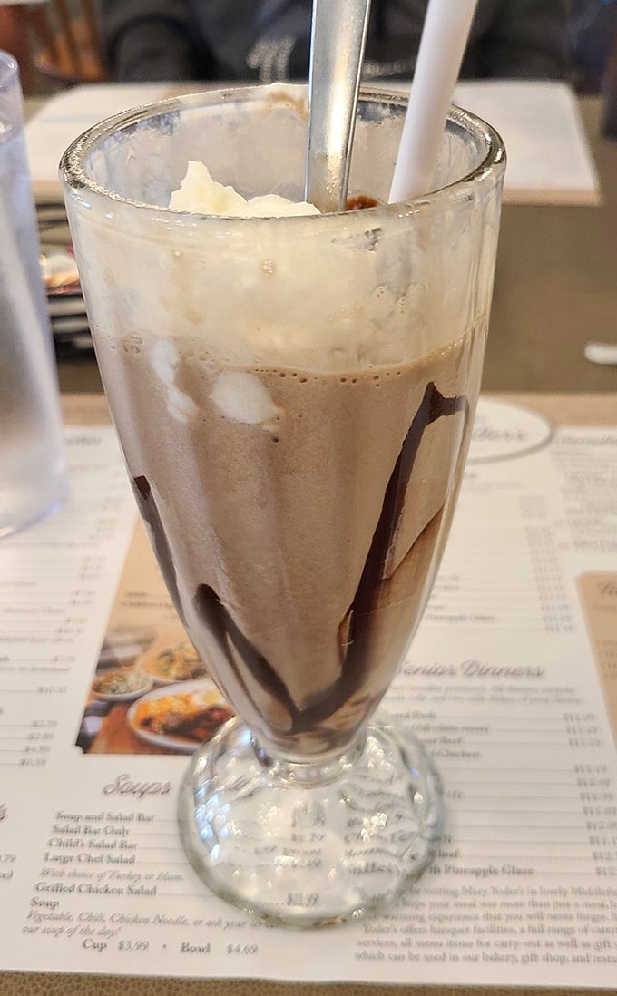 This chocolate milkshake isn't just a drink—it's a time machine back to when happiness came in a tall glass with whipped cream on top.