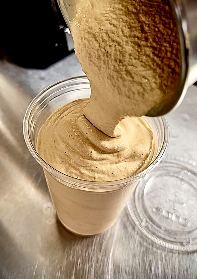 The chocolate milkshake so thick it defies gravity. This isn't a drink—it's dessert with a straw and a direct line to childhood joy.