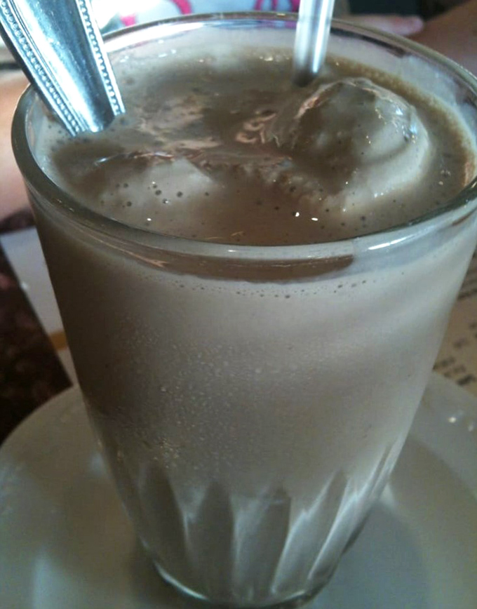 This chocolate shake isn't just a drink, it's a time machine—one sip and you're suddenly twelve years old again, with nothing more important to do than enjoy every creamy spoonful. 