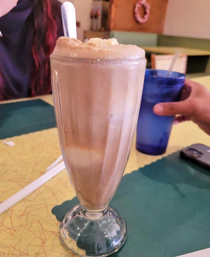 When a milkshake comes in a classic fountain glass with that perfect consistency – not too thick, not too thin – you know you've found an authentic American diner.