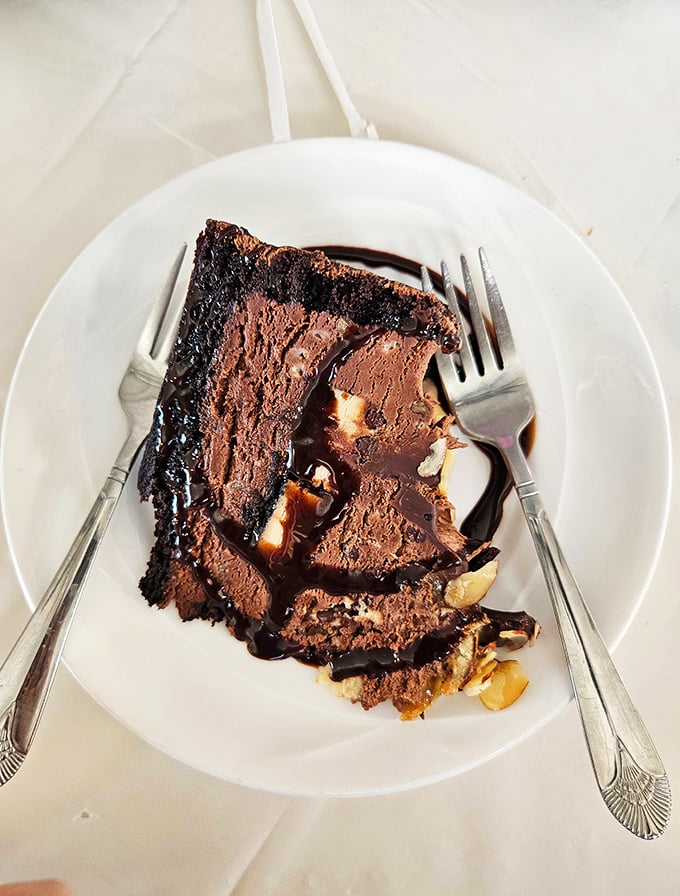 This isn't just chocolate cake – it's a declaration of devotion to cocoa, with layers that collapse into fudgy surrender at the touch of a fork.