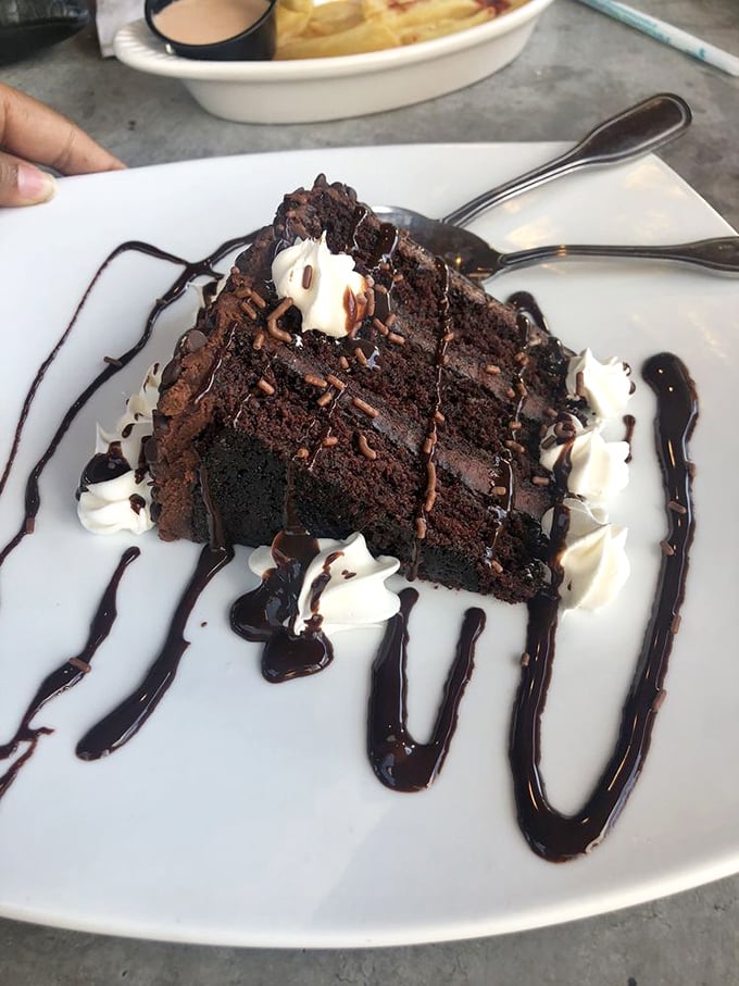 This chocolate cake isn't just dessert—it's an event. The kind that makes nearby tables ask, "What is THAT and how do I get one?"