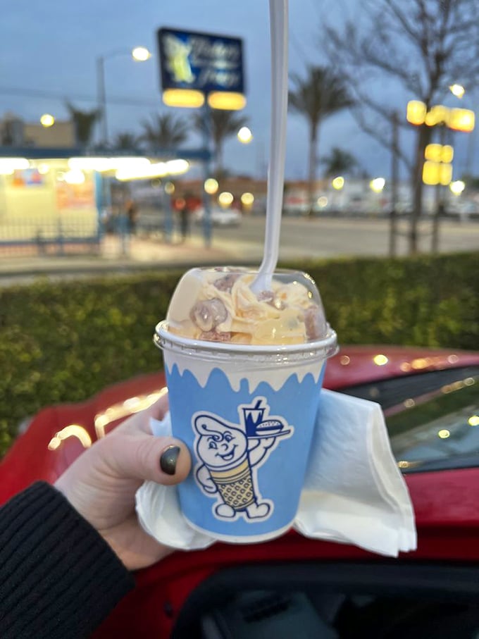 Dessert archaeology at its finest—dig through layers of vanilla soft-serve to discover buried cookie treasure.