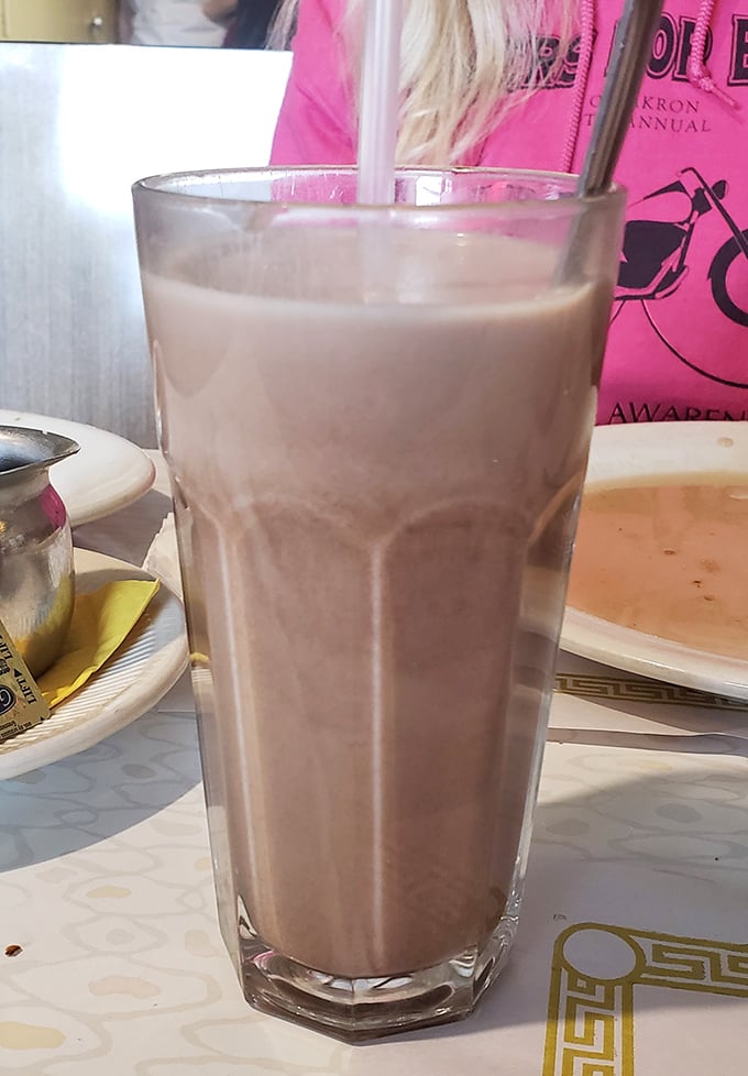 This chocolate milkshake isn't just thick—it's the kind that makes your straw stand at attention while your diet plan quietly weeps.