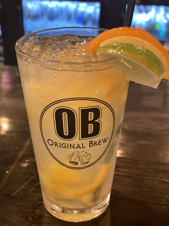 The "OB Original Brew" isn't just a drink—it's summer in a glass, complete with citrus slices that add both color and vacation vibes.