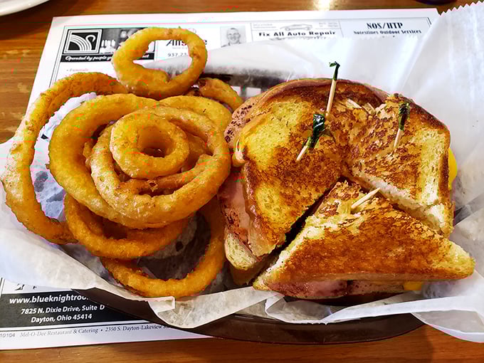 A sandwich and onion rings that remind you why simple food, done right, beats fancy cuisine every time. No foam or tweezers required.