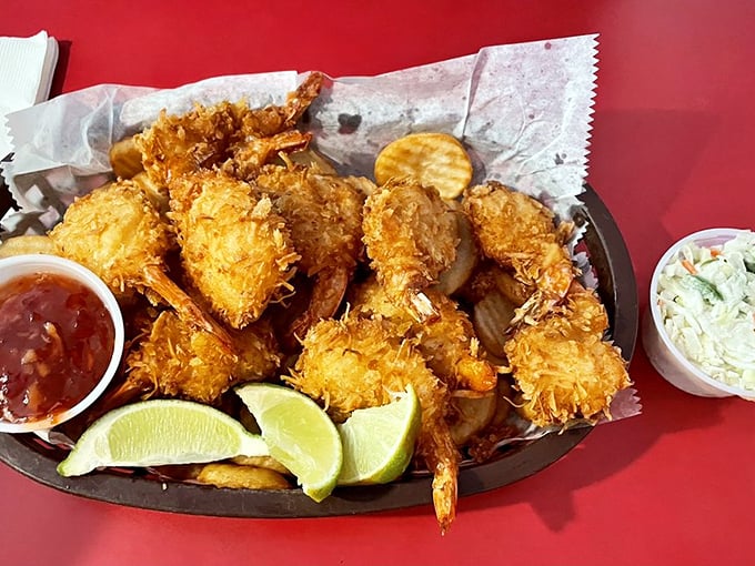 Golden coconut shrimp that crunch like autumn leaves, with sweet flesh inside that tastes like the ocean took a vacation in the tropics.