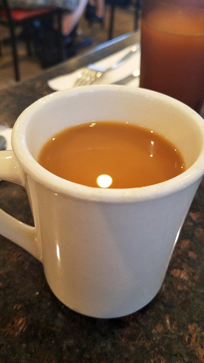 That first sip of diner coffee – the liquid courage needed before making important breakfast decisions.