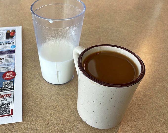 Coffee served in those sturdy mugs that feel like an old friend's handshake – the kind that keeps you warm long after the caffeine kicks in.