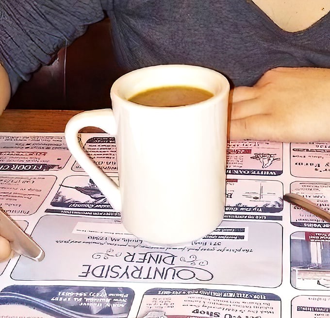 Simple coffee in a simple mug—the perfect dance partner for pastry extravagance. No foam art needed when the donuts are the real stars.